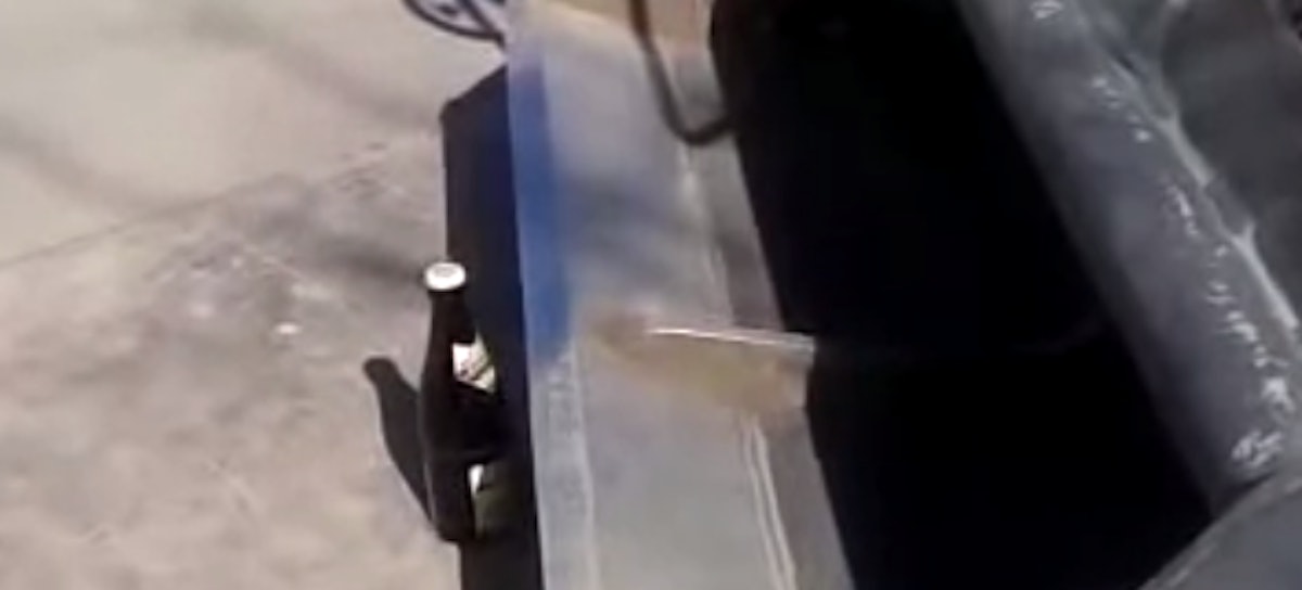 Smooth German operator opens his beer with a compact excavator ...