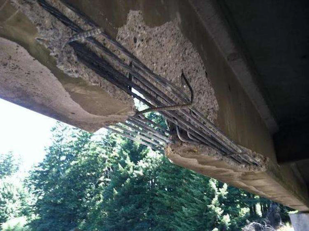 Truck hauling excavator collides with 5 bridges, taking a chunk out of ...