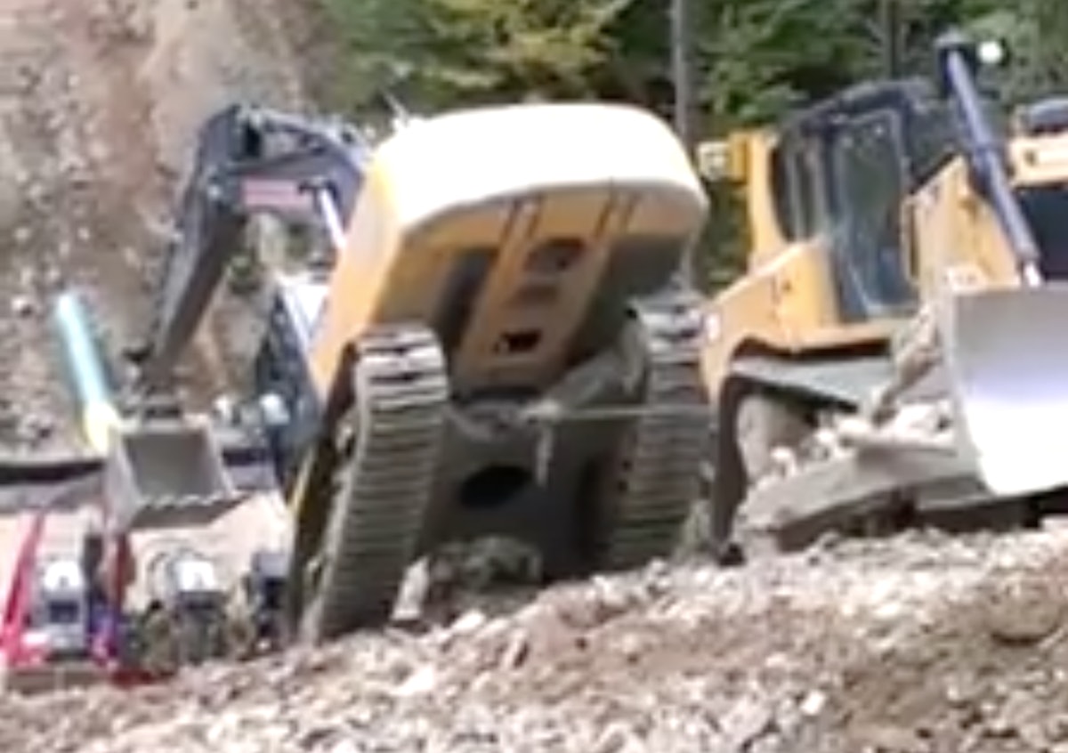 3 dozers pull upended excavator and a bunch of gear up a ridiculous ...