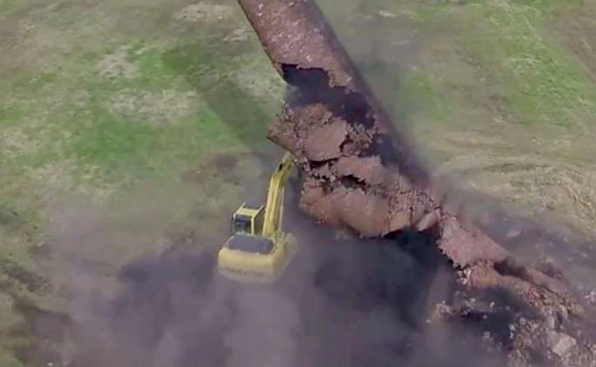 Smokestack collapse crushes excavator cab, somehow doesn’t kill ...