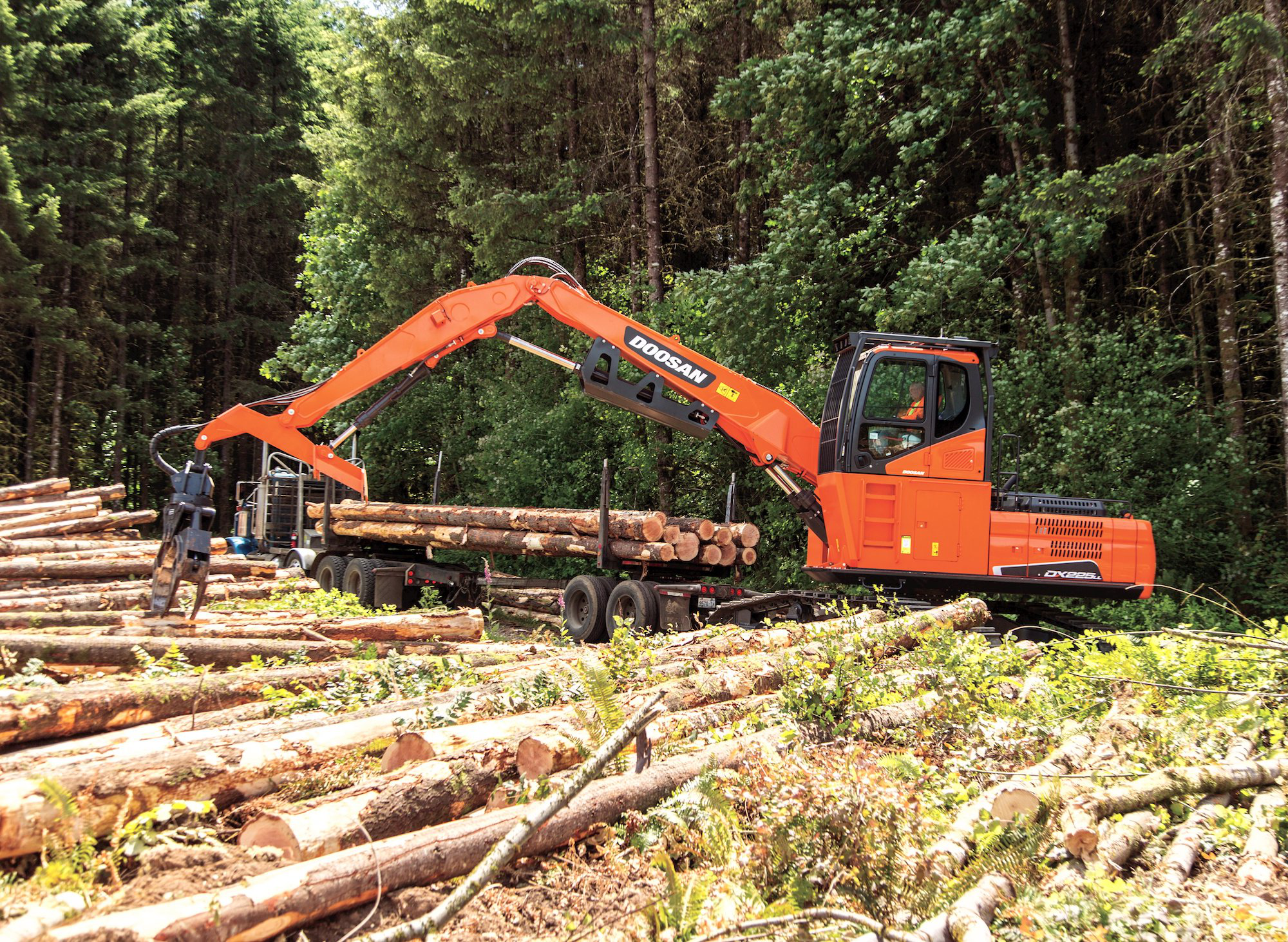 Doosan launches DX225LL-5 log loader with cab, engine improvements ...