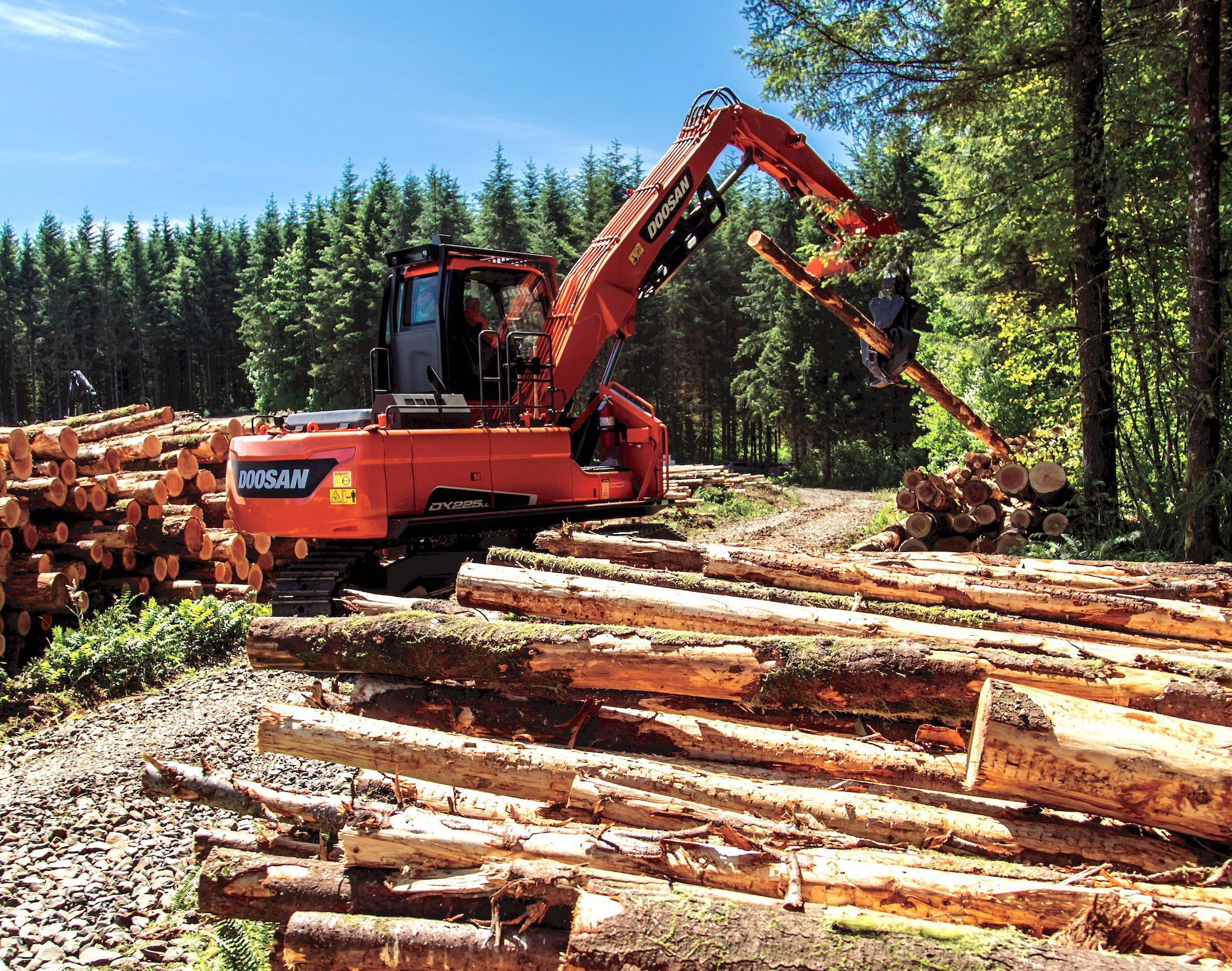 Doosan launches DX225LL-5 log loader with cab, engine improvements ...