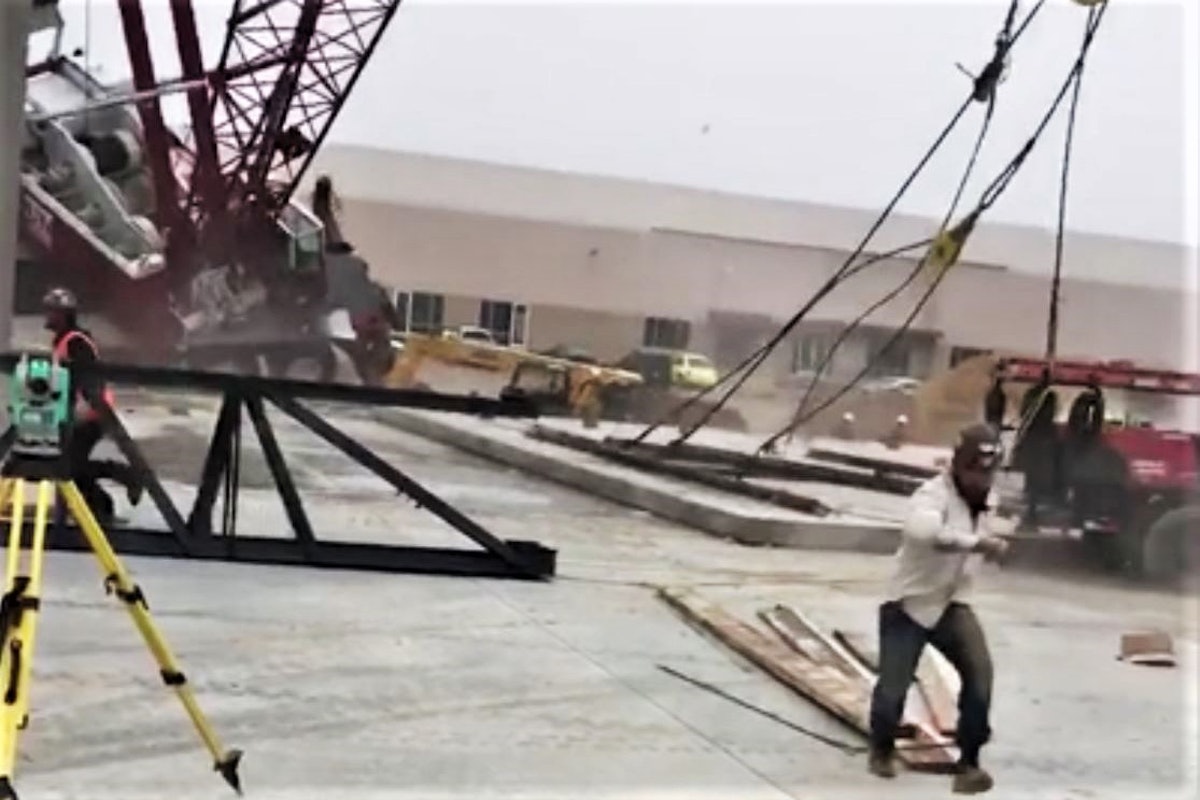 Crane collapse during lift of concrete wall sends workers scrambling ...