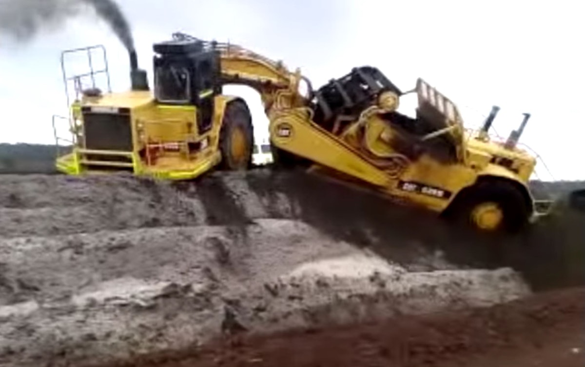 Scraper gets help from a dozer when it begins to slip | Equipment World