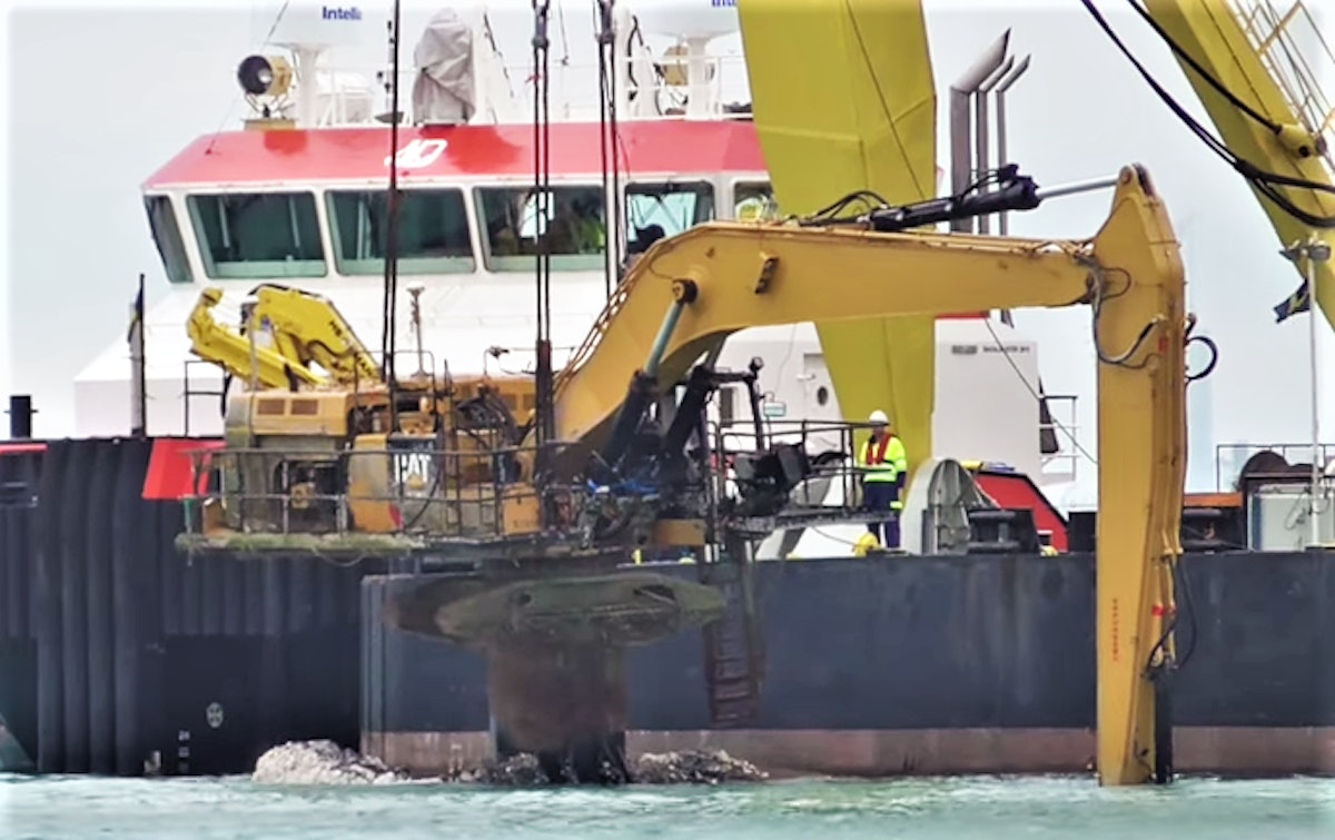 Cat 374DL elevated excavator sinks into the ocean floor | Equipment World