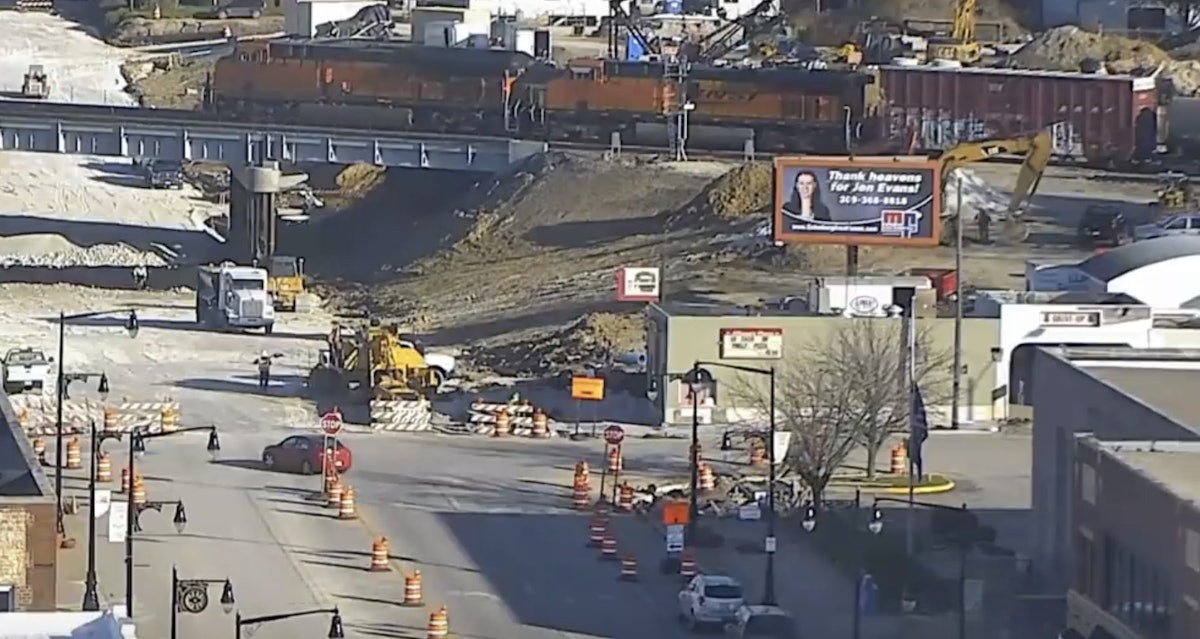 Crews excavate and build underpass beneath active railroad tracks in ...