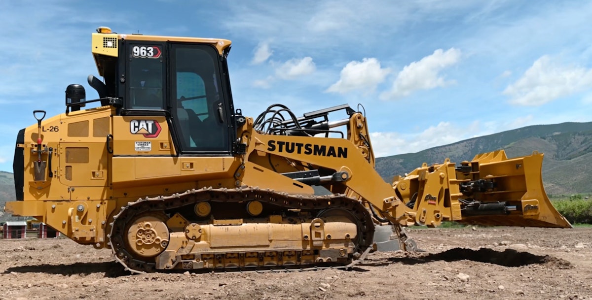 Cat 963 track loader equipped with 6-way dozer blade (Video) | Equipment World